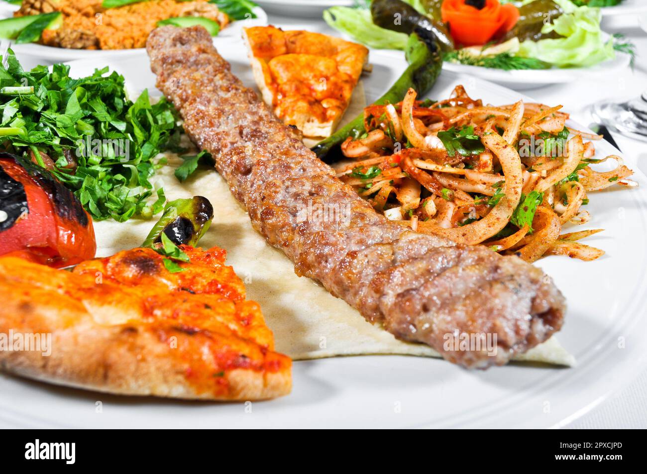 A magnificent dining table and adana shish kebab in a luxury restaurant ...
