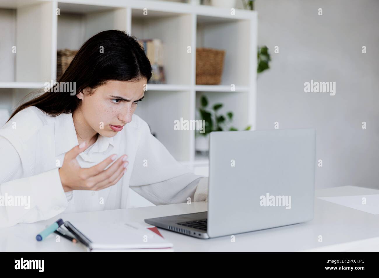 Angry young woman at home office desk work online on computer, have ...