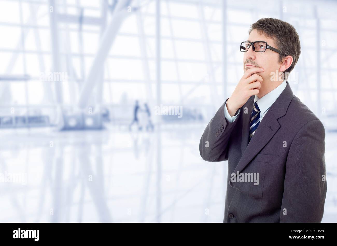young business man thinking, at the office Stock Photo - Alamy