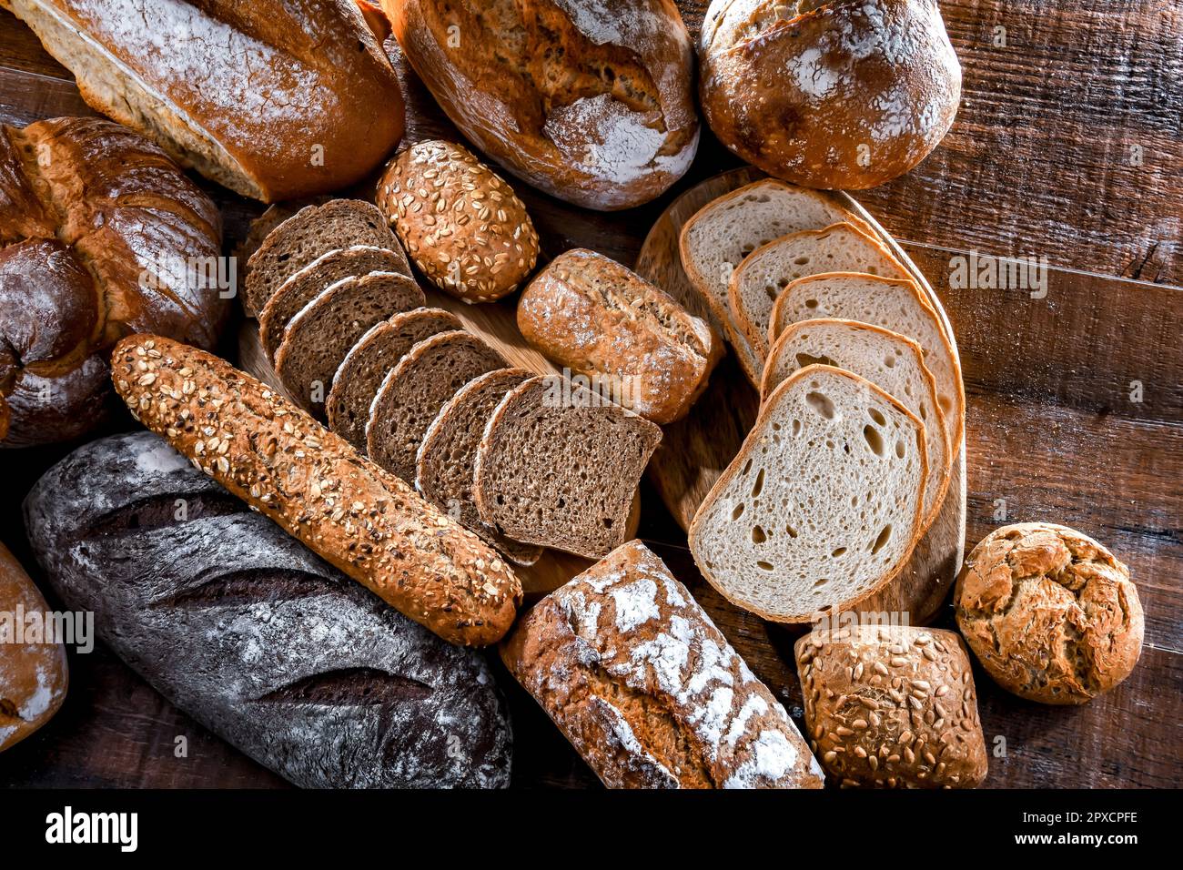 Assorted bakery products including loafs of bread and rolls Stock Photo ...