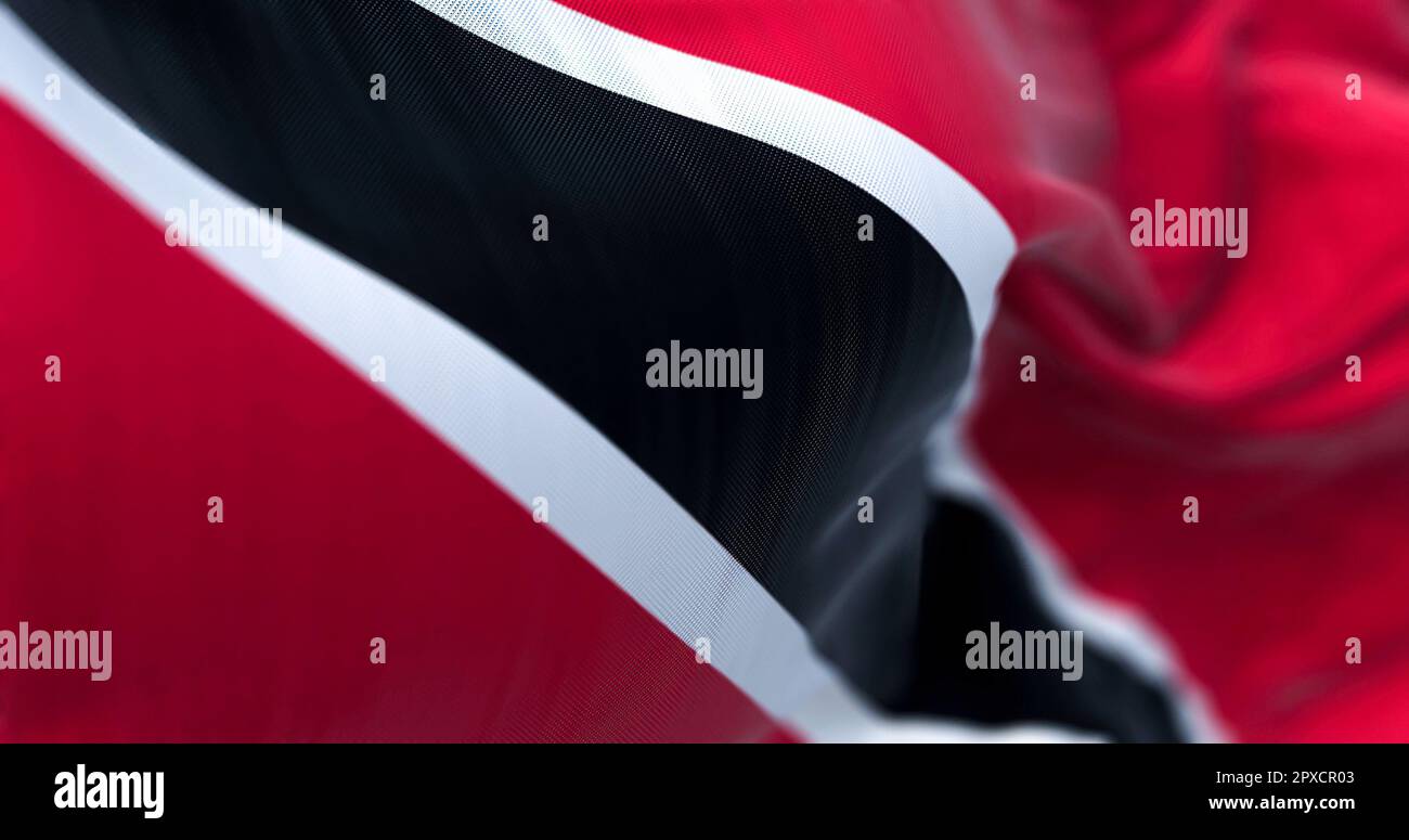 Detail of Trinidad and Tobago national flag waving. The Republic of Trinidad and Tobago is an ...