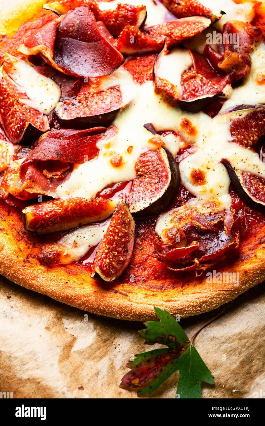 Homemade meat pizza with cheese and figs Stock Photo - Alamy