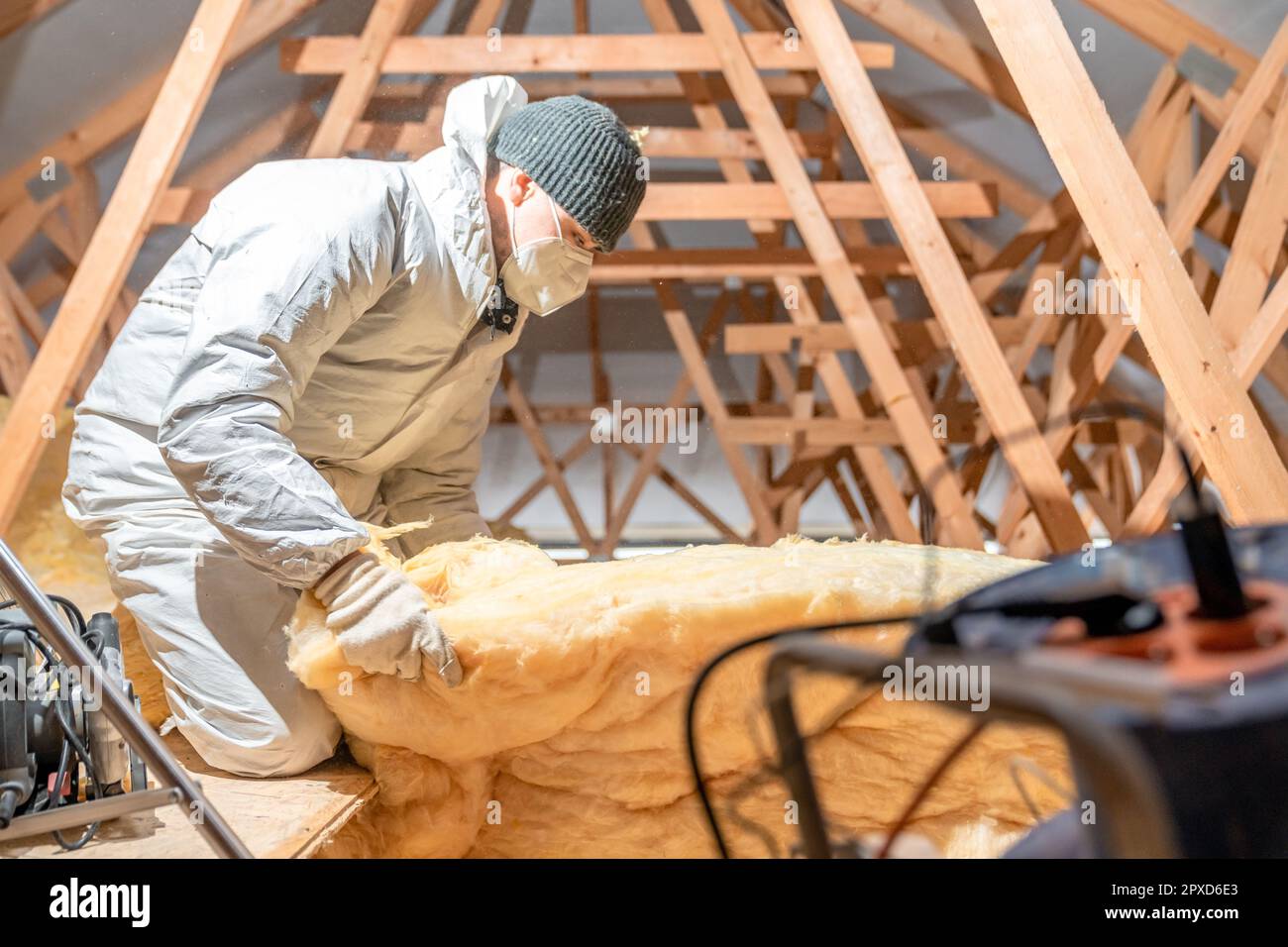 insulation of the roof and ceiling with glass wool Stock Photo - Alamy