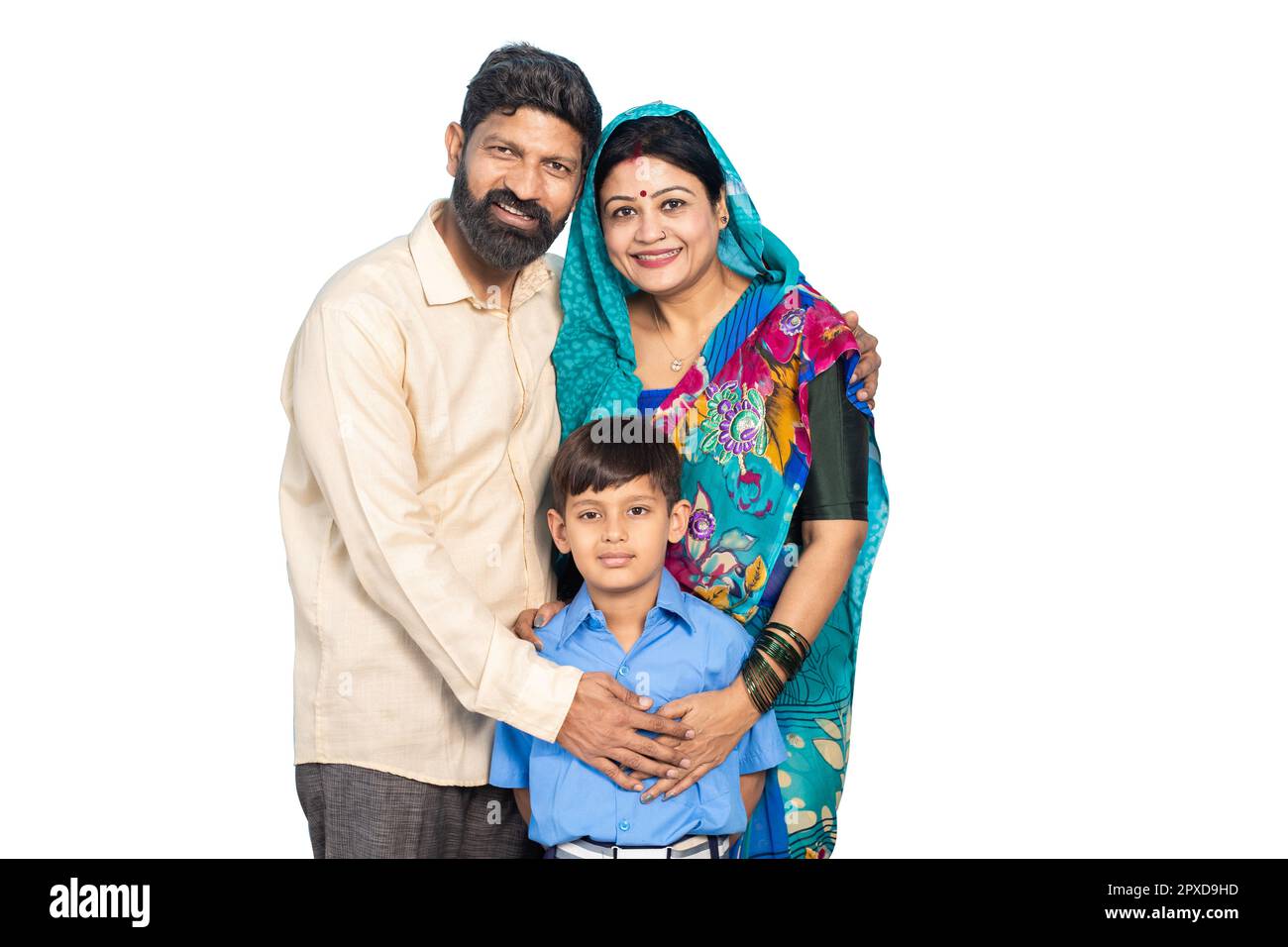 Young happy indian parents standing with little son wearing school ...