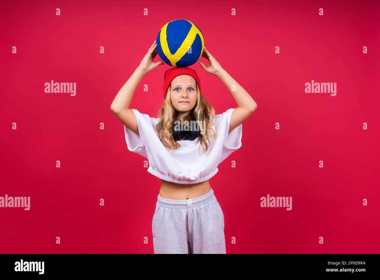 Portrait Of Cute Eight Year Old Girl In Volleyball Outfit Isolated On A