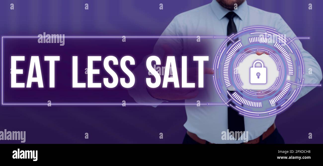 Hand writing sign Eat Less Salt, Internet Concept reducing the sodium ...