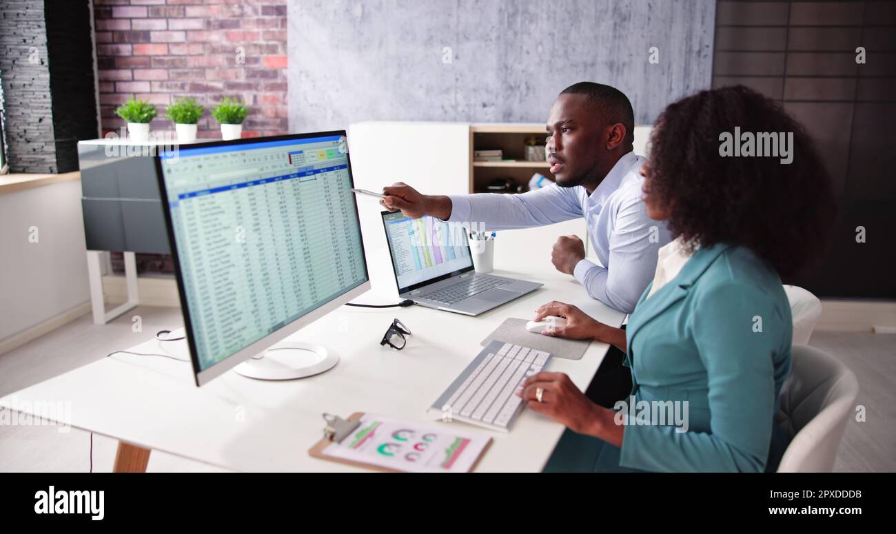 Analyst Employee Working On Spreadsheet Using Desktop Computer Stock ...