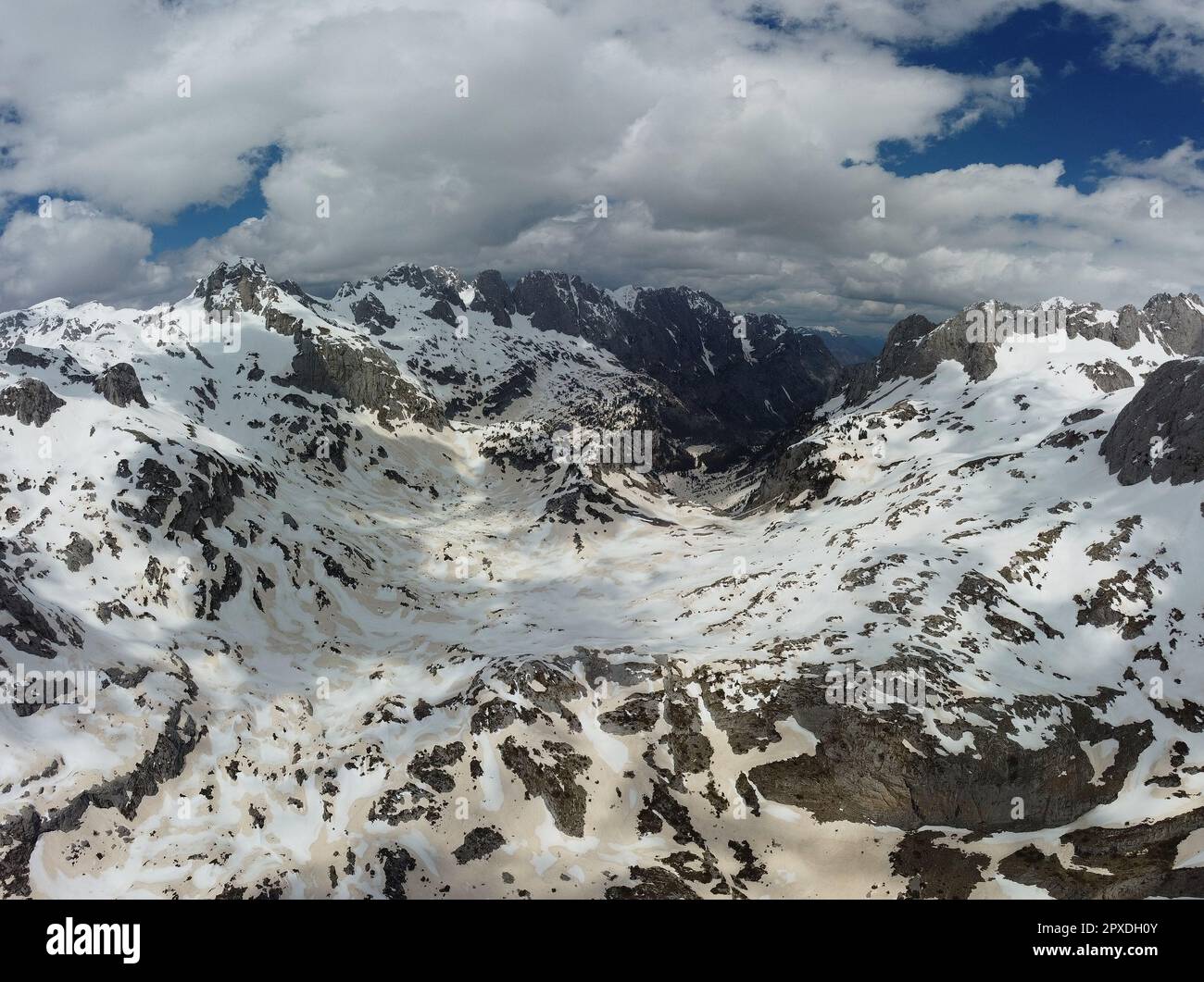 Panorama looking down over the Qafa e Pejes pass with the snow capped ...