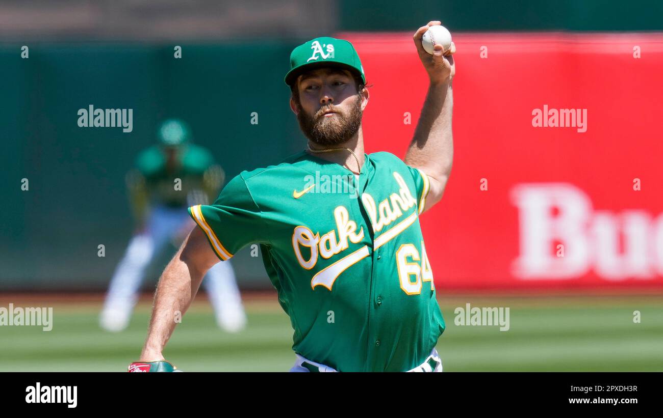 Oakland Athletics pitcher Ken Waldichuk throws against the Cincinnati ...