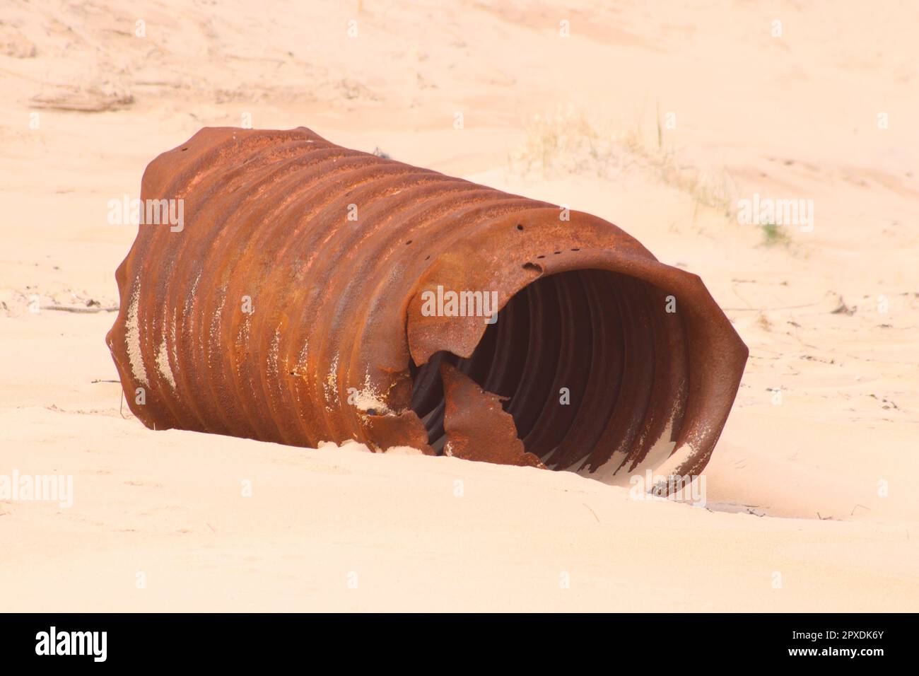 Rusty corrugate metal tube washed up on beach Stock Photo - Alamy
