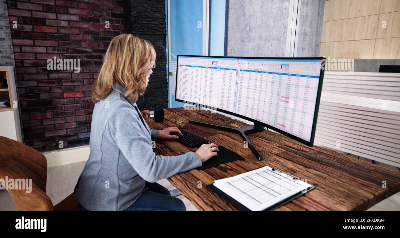 Data Analyst Woman Using Spreadsheet On Computer Stock Photo - Alamy