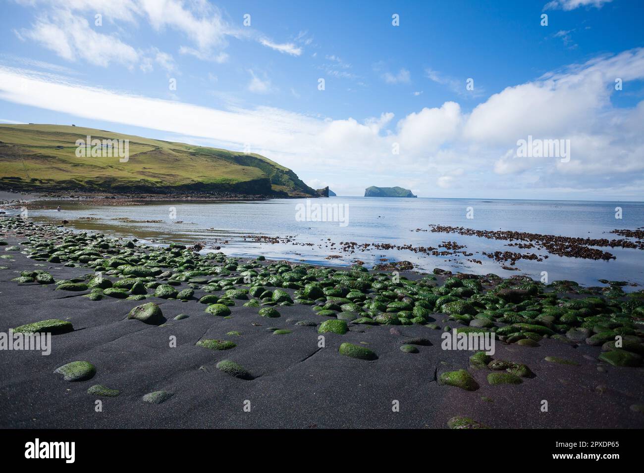 Vestmannaeyjar island beach view with Alsey island in background ...