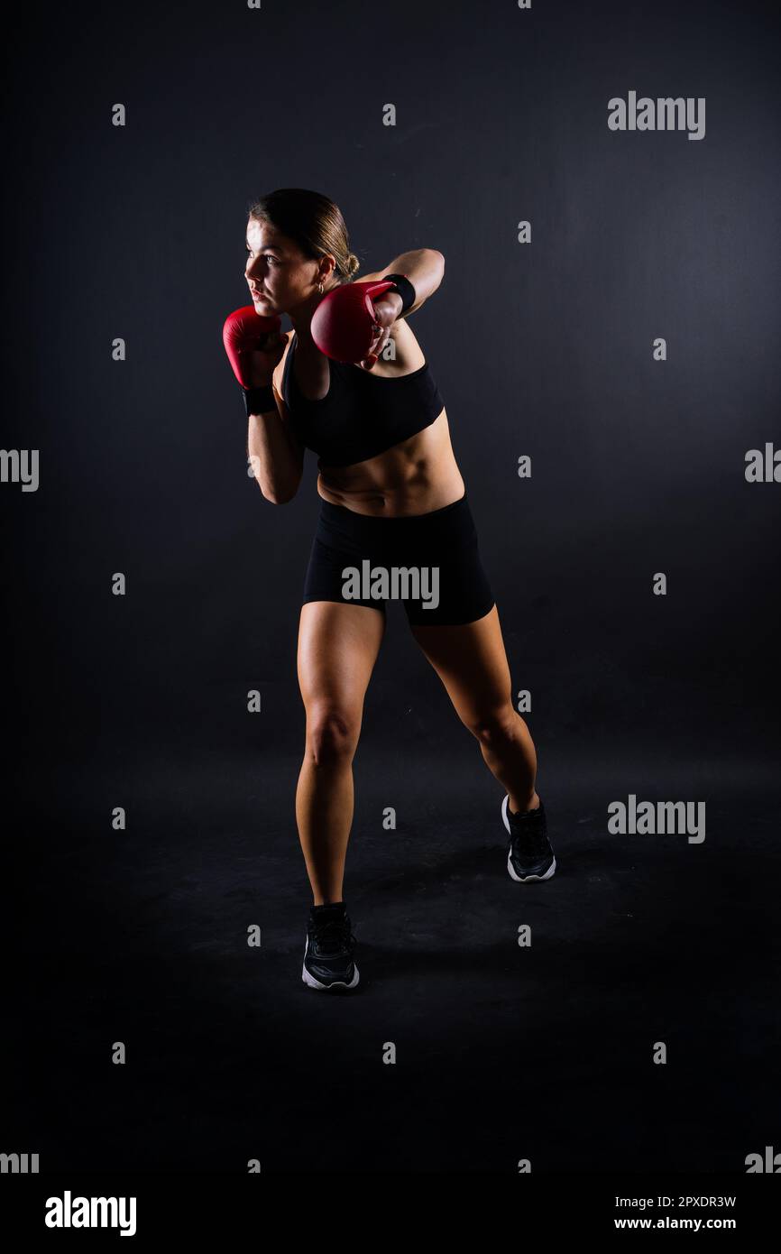 Young woman athletic female MMA fighter is training. Concept of sport ...