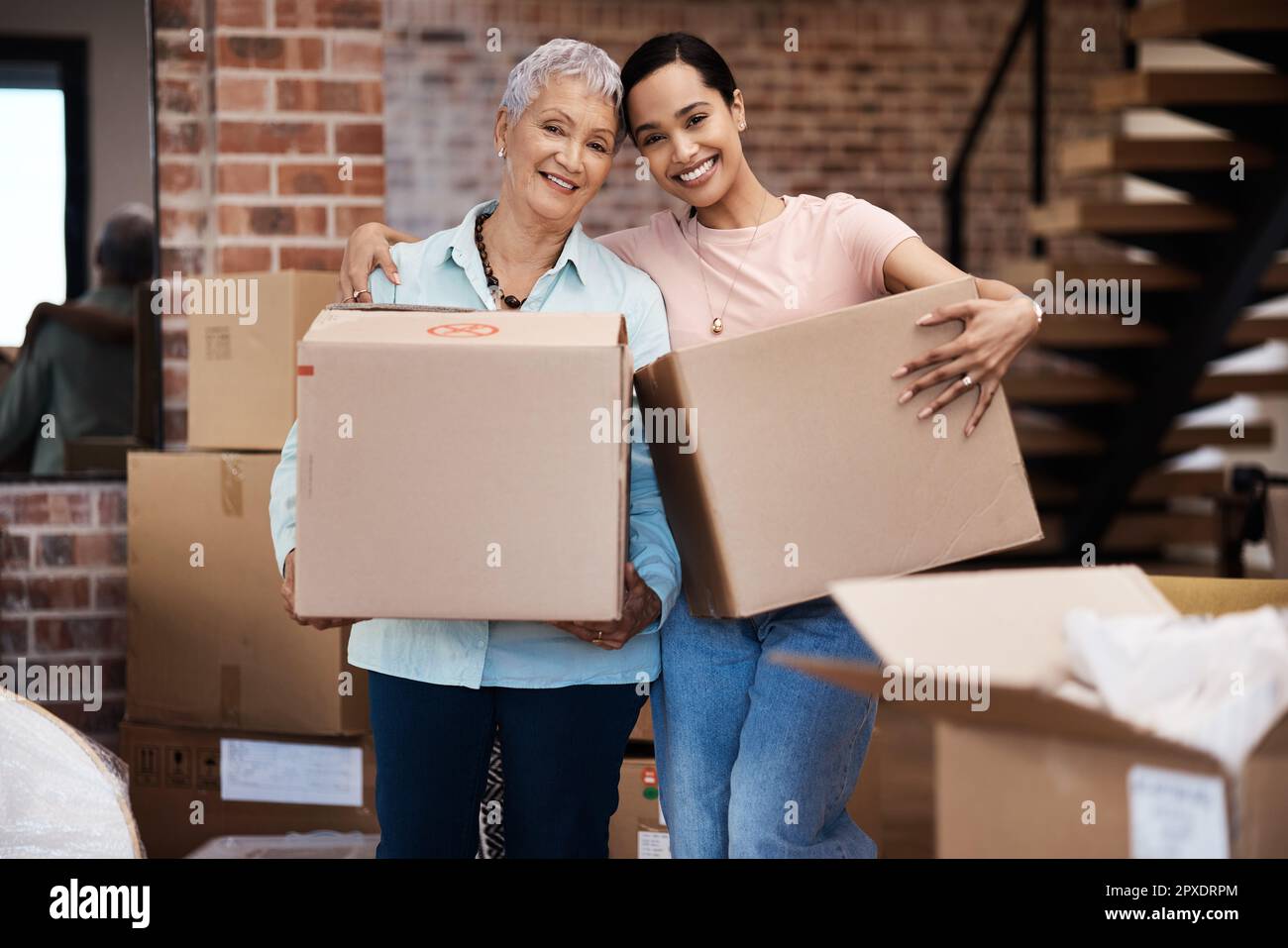 Time to fill a new home with memories. a senior woman moving house with ...