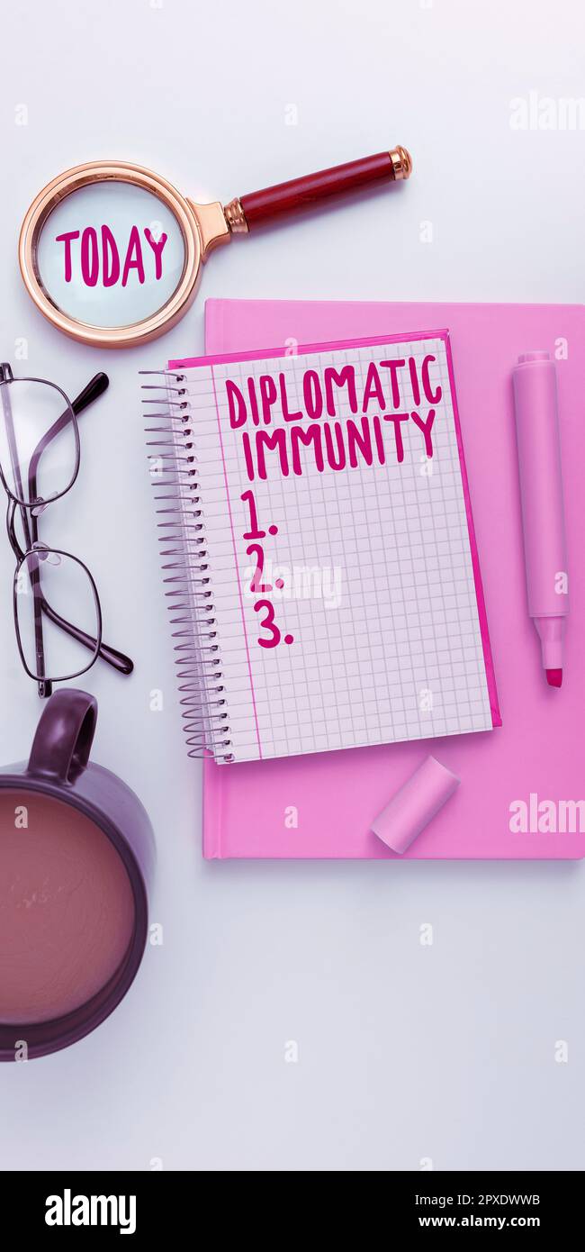 Hand writing sign Diplomatic Immunity, Word for law that gives foreign ...