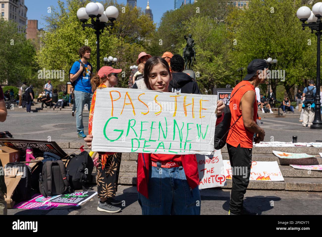 A person holding a sign at the Earth Day Rave Revolution in Union ...
