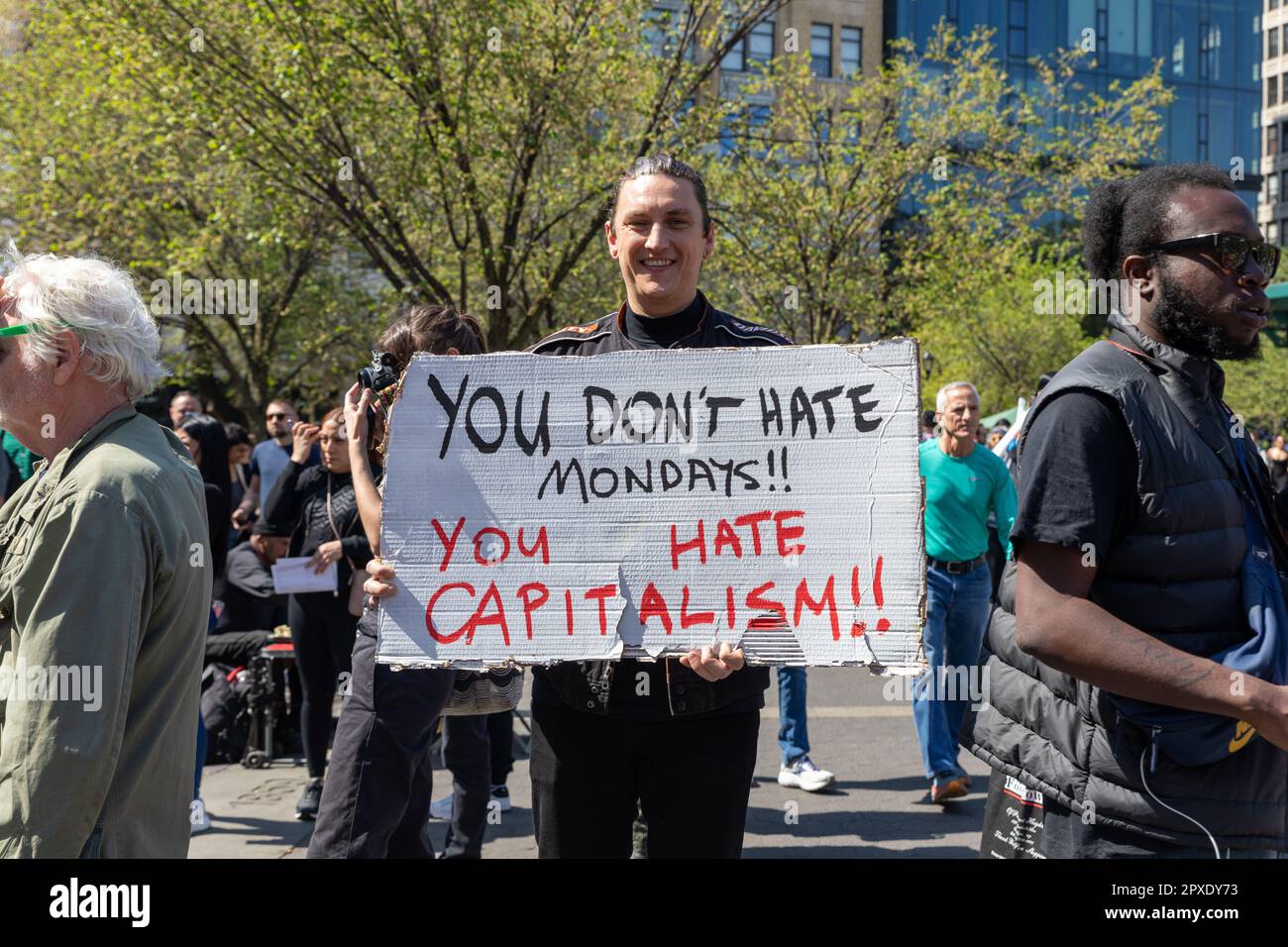 A person holding a sign at the Earth Day Rave Revolution in Union ...