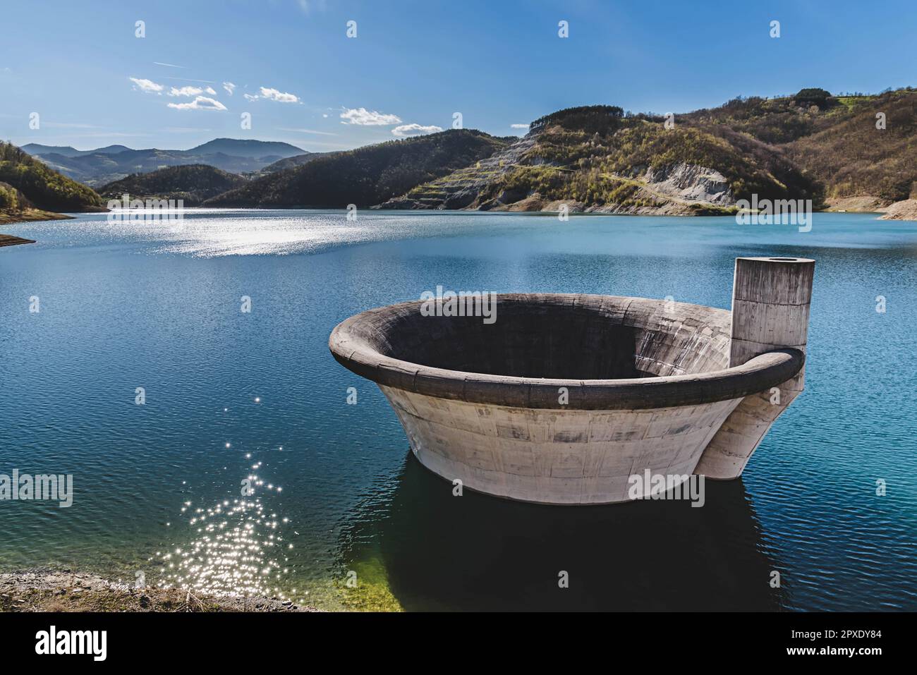 Dam Spillway Funnel above Lake Water Surface Stock Photo - Alamy