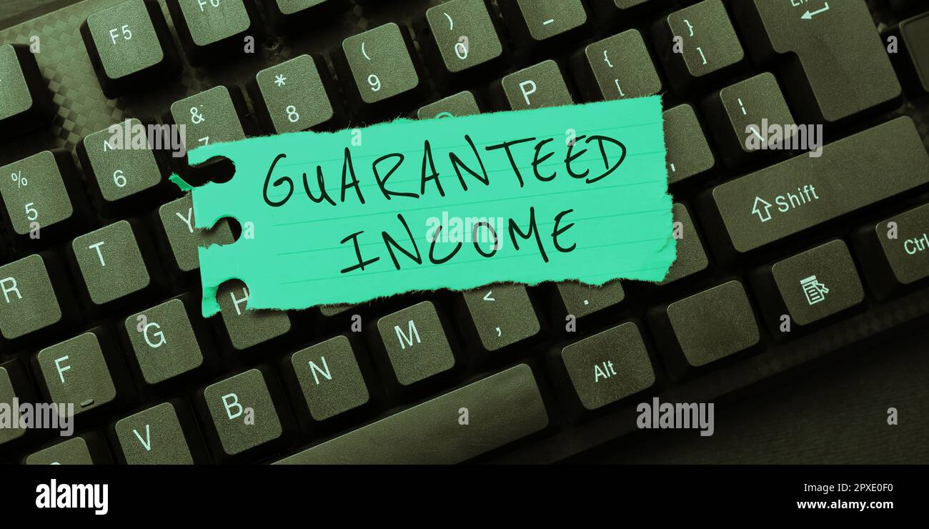 Sign displaying Guaranteed Income, Business approach earnings from ...