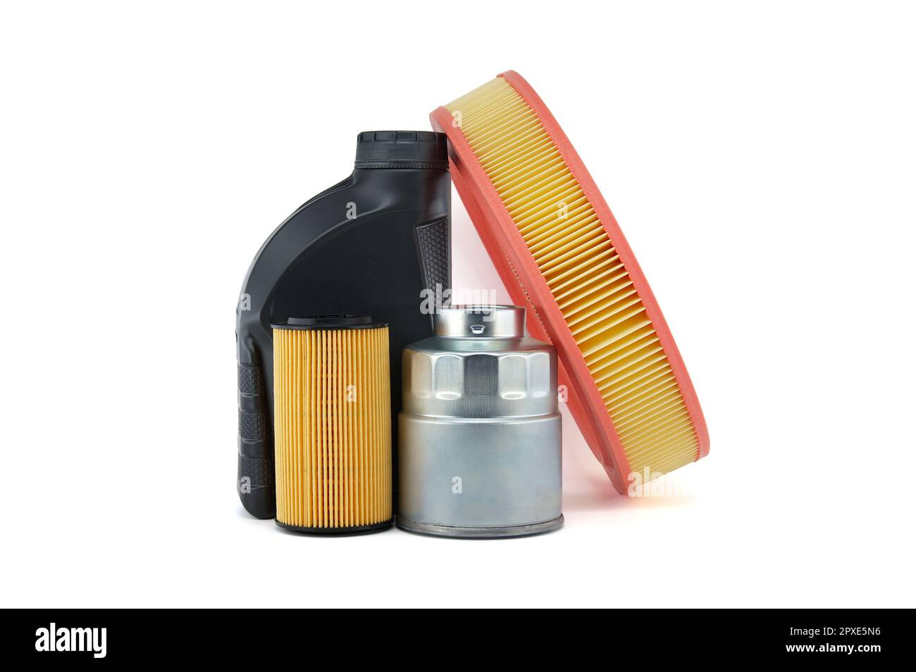 Vehicle engine round air filter, fuel and oil filters near motor oil ...