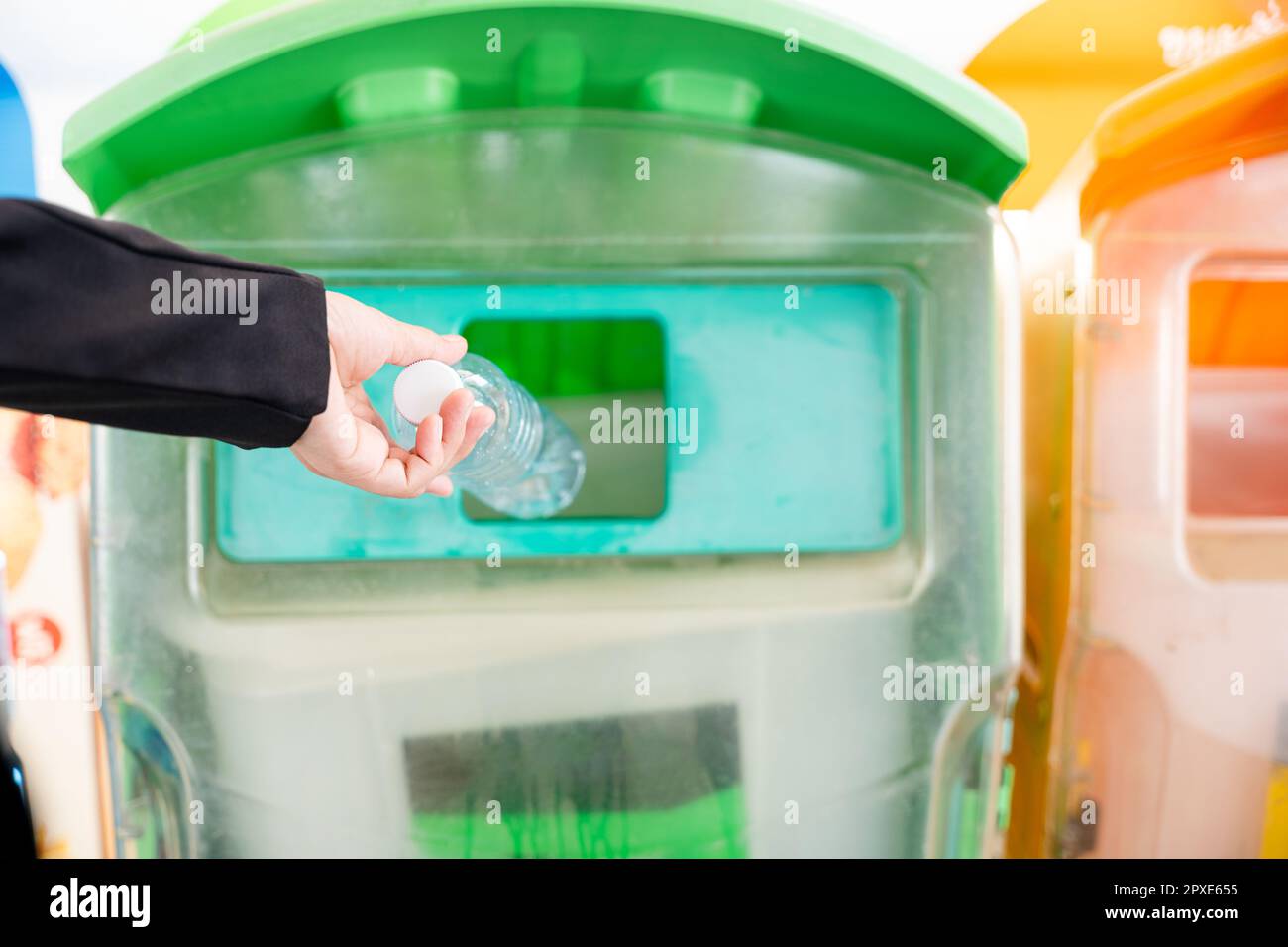 World Environment Day concept. Business woman throwing empty plastic ...