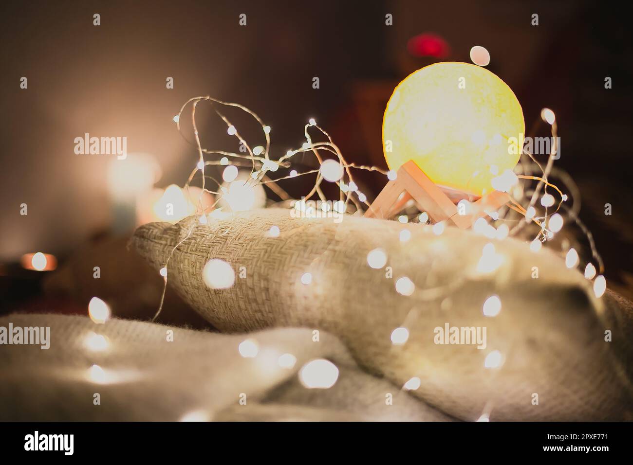 Close up moon lamp with light bulb garland concept photo. Romantic xmas ...