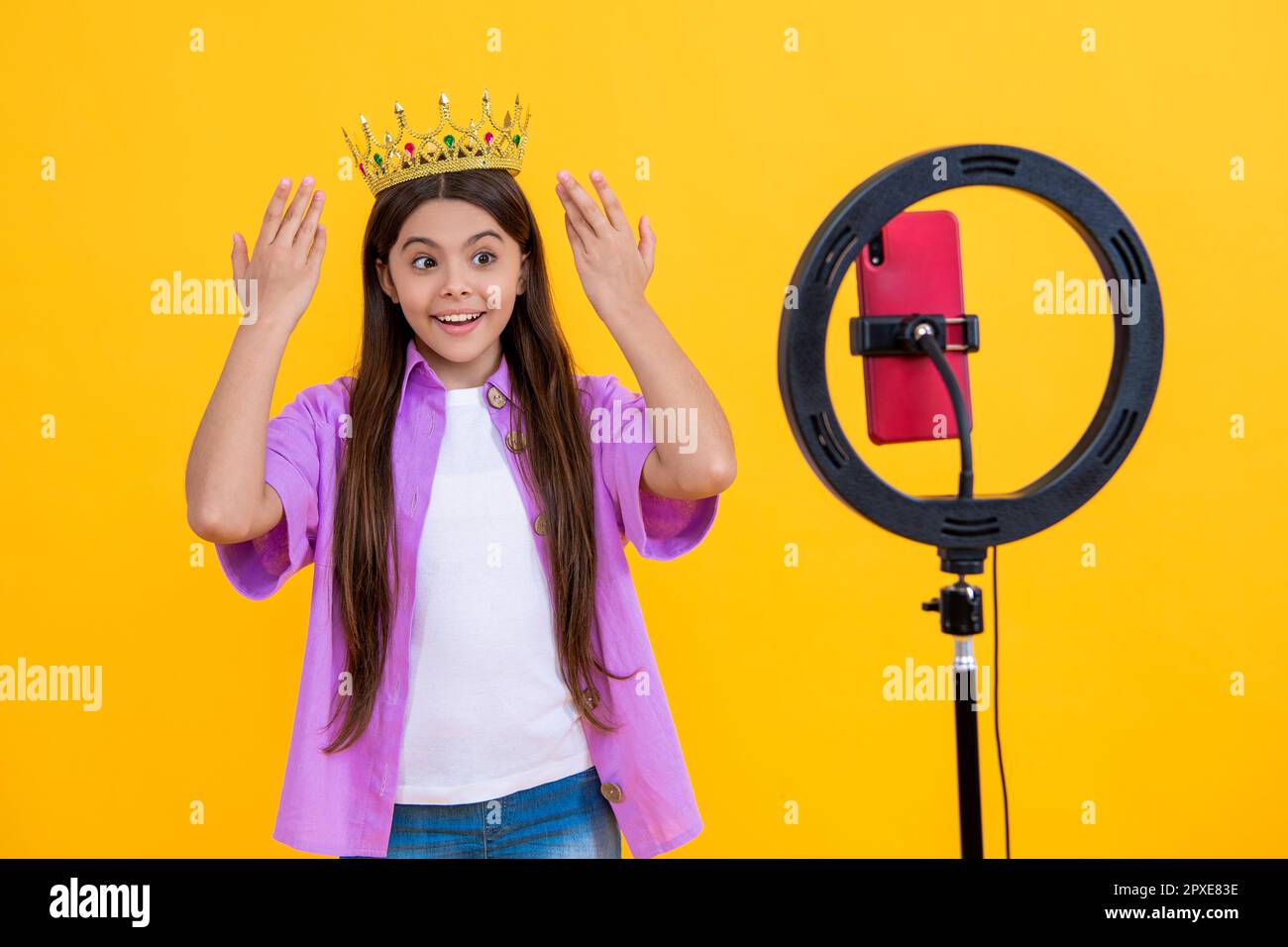 amazed teen girl influencer with crown in studio. teen girl influencer ...