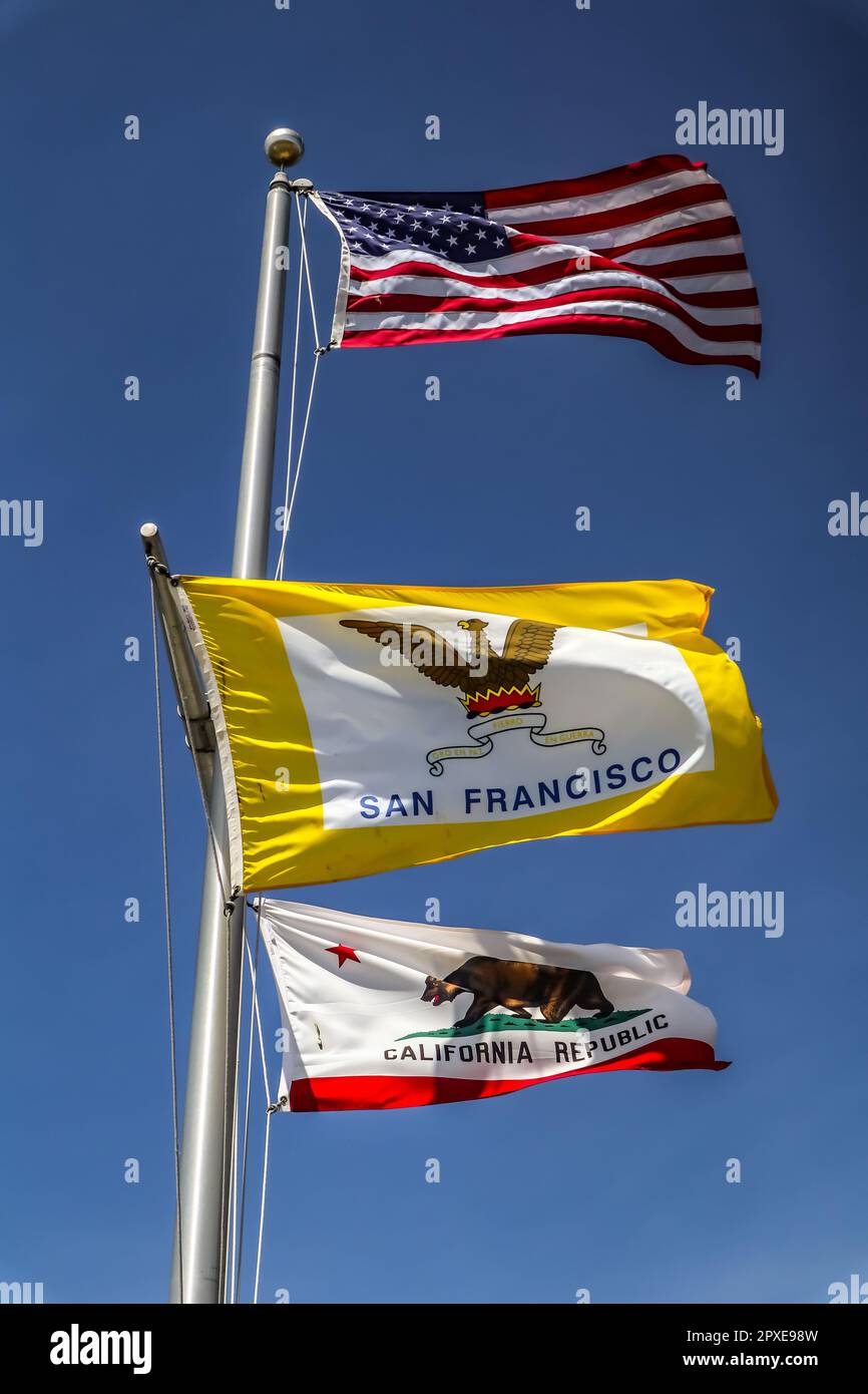 The flags of the United States, California, and San Francisco flying in ...