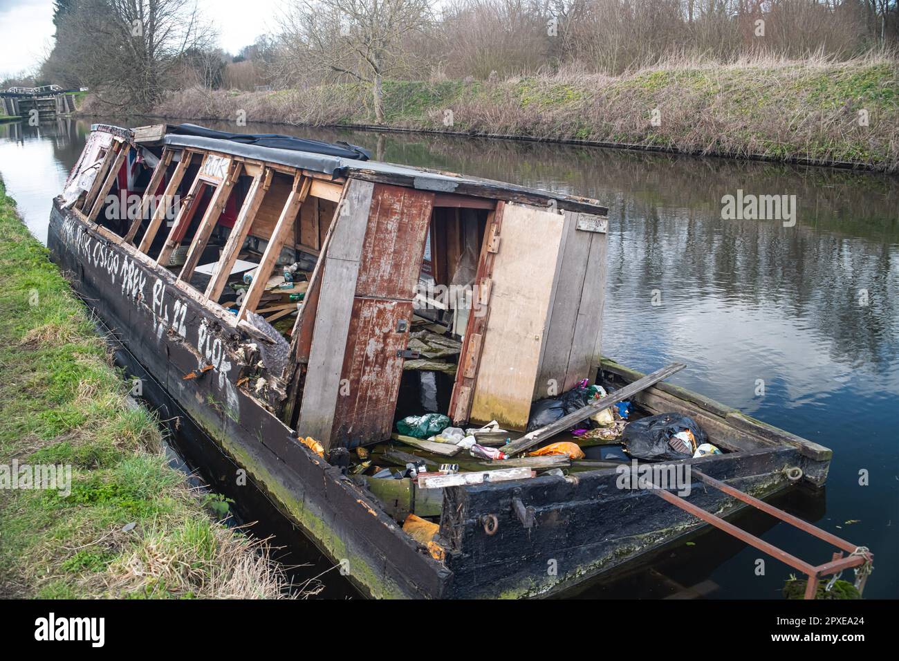 Partially submerged canal barge, VANDALISED Stock Photo - Alamy