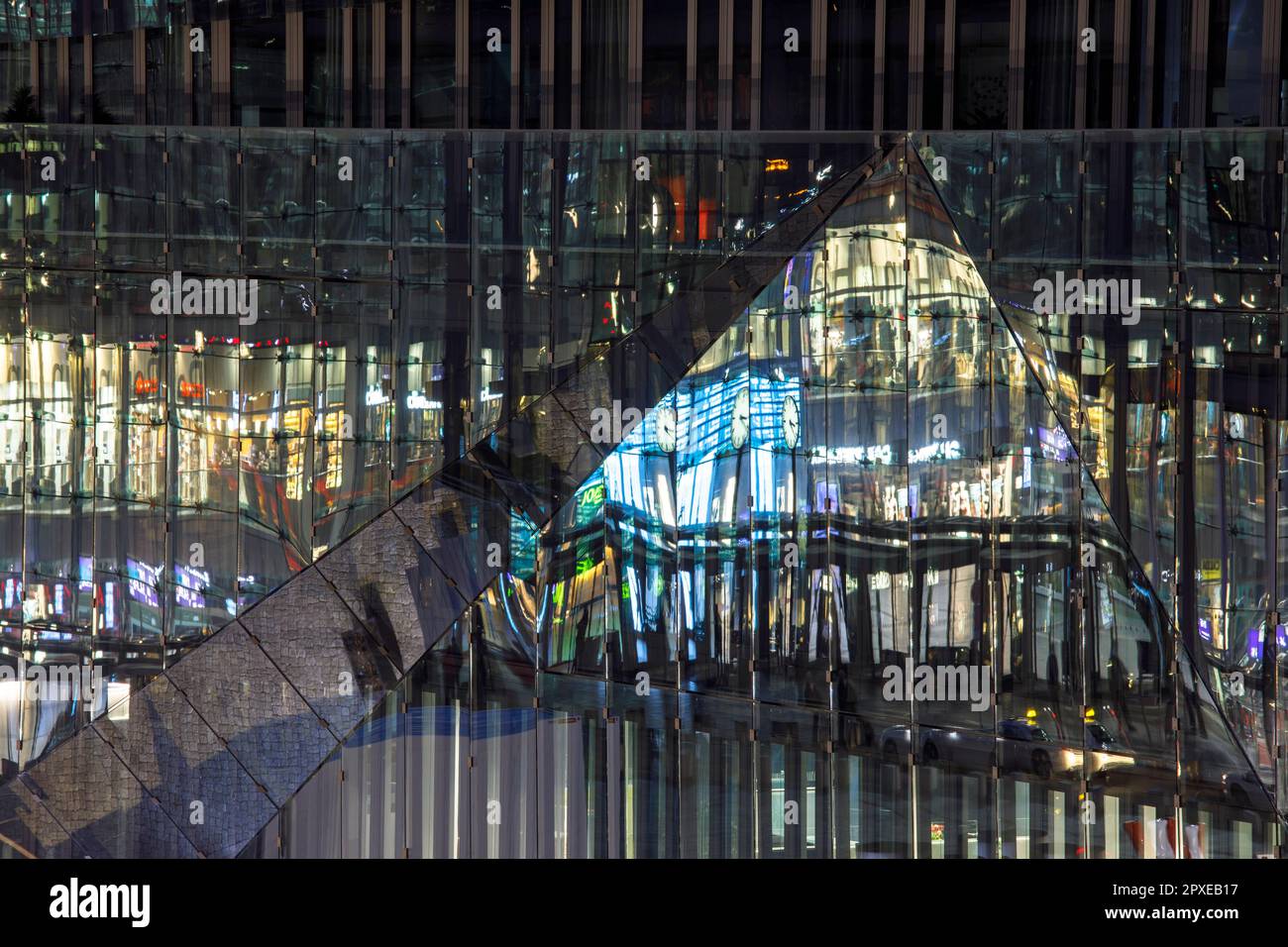 facade of Cube Berlin at night, cube-shaped office building on ...
