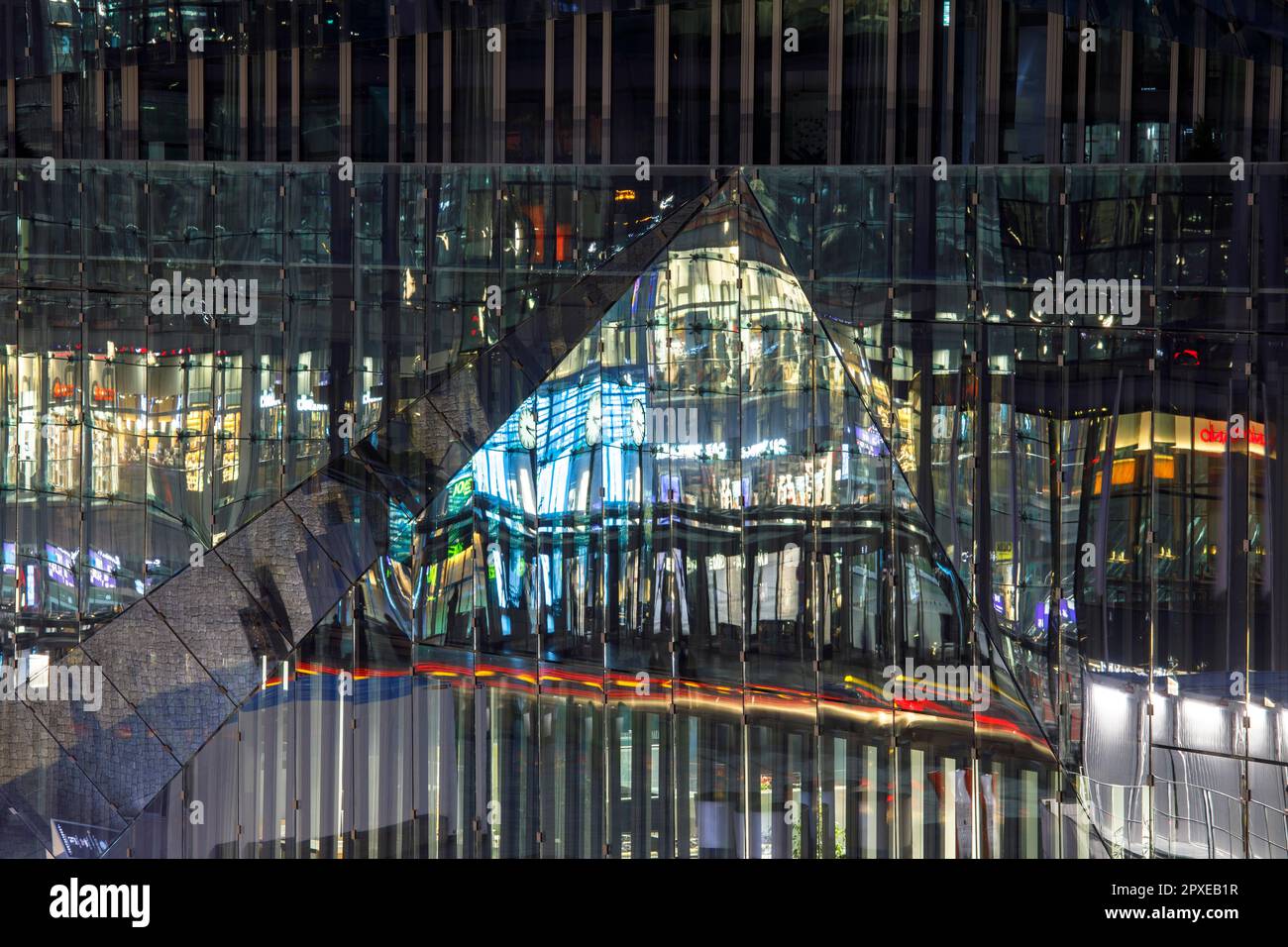 facade of Cube Berlin at night, cube-shaped office building on ...