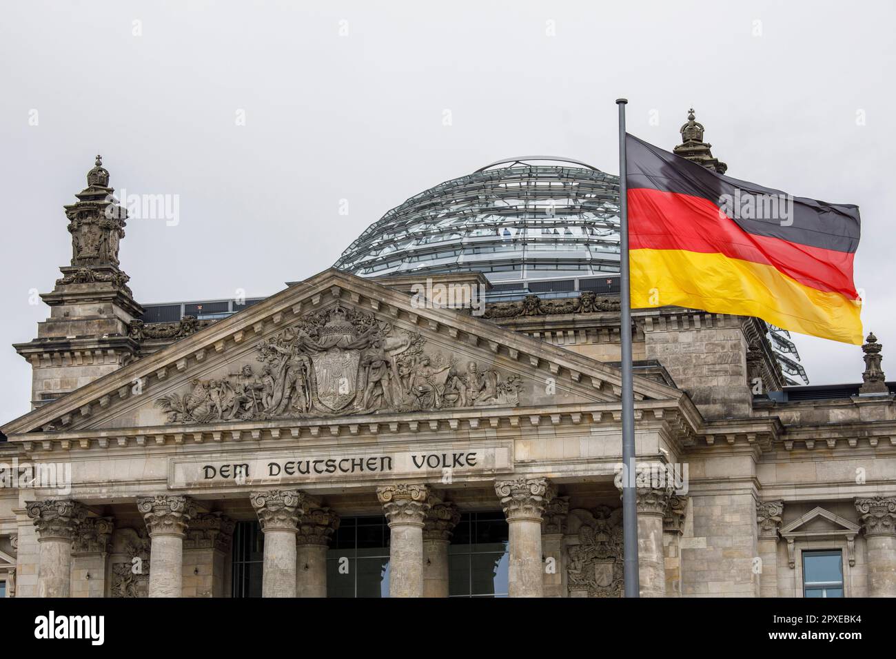 Reichstag building with dome and German flag on Platz der Republik ...