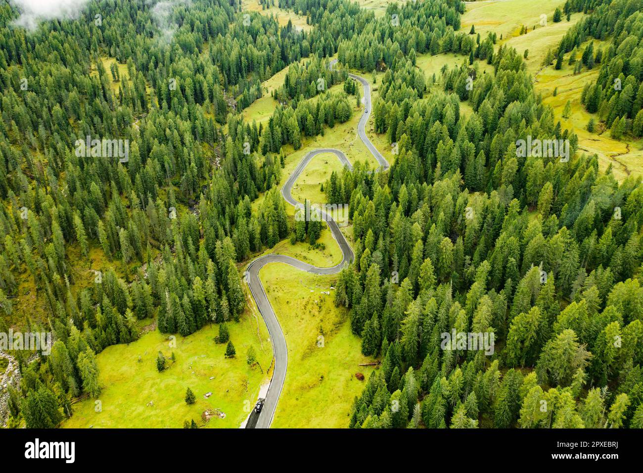 Snake Road winds across coniferous forests of Alpine mountains ...