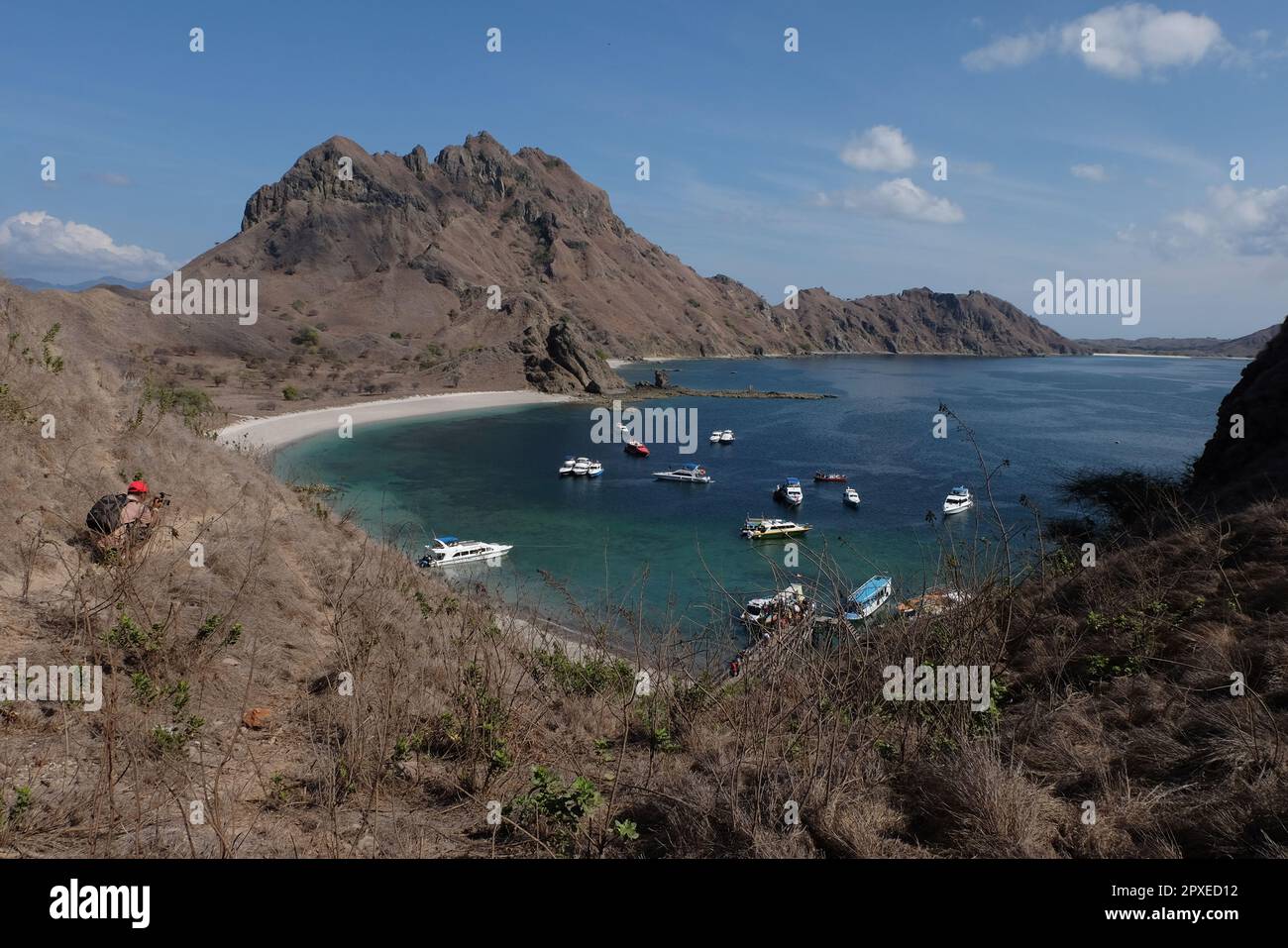 Tourists visiting Padar Island in Labuan Bajo during the dry season, a ...