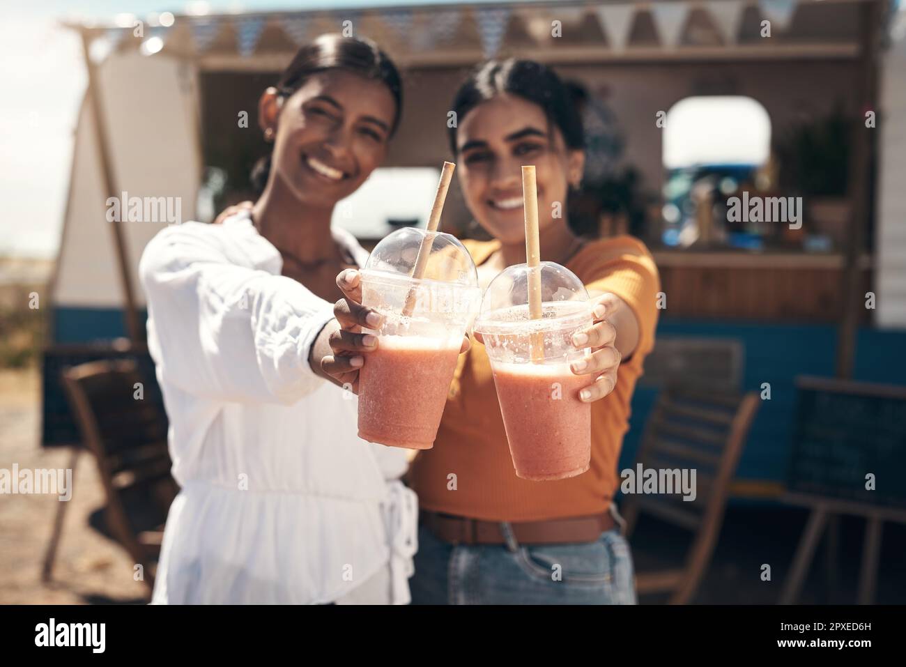 Spend time with those you love. two friends enjoying smoothies together ...