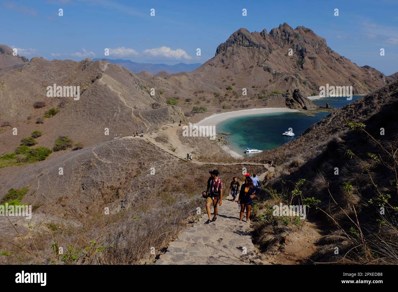 Tourists visiting Padar Island in Labuan Bajo during the dry season, a ...