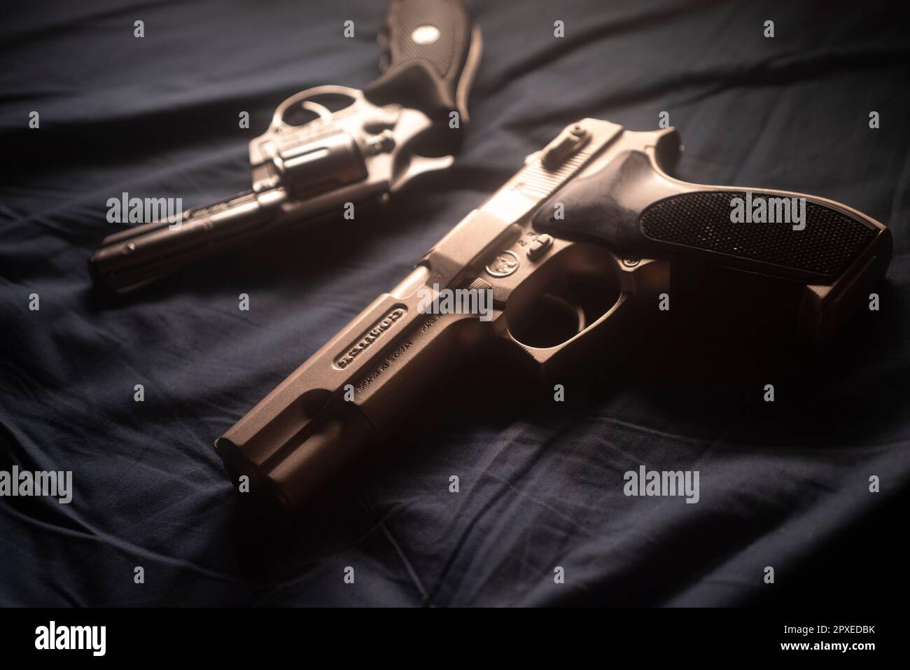 Pistol gun on bed sheet still life crime thriller book cover design ...