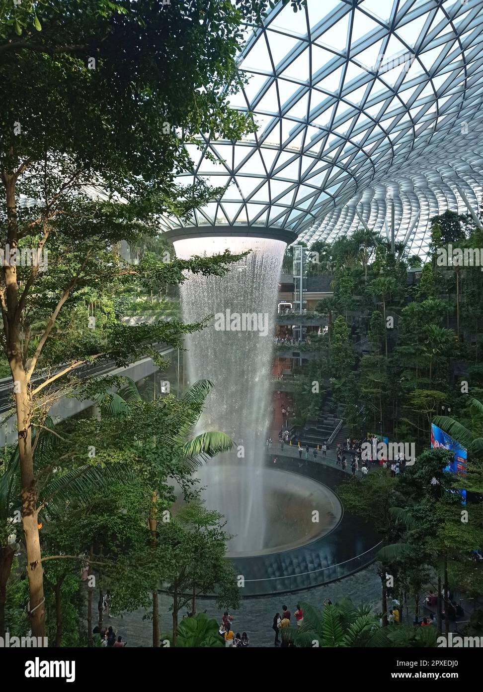 A vertical shot of the flowing waterfall in the Jewel Changi airport in ...