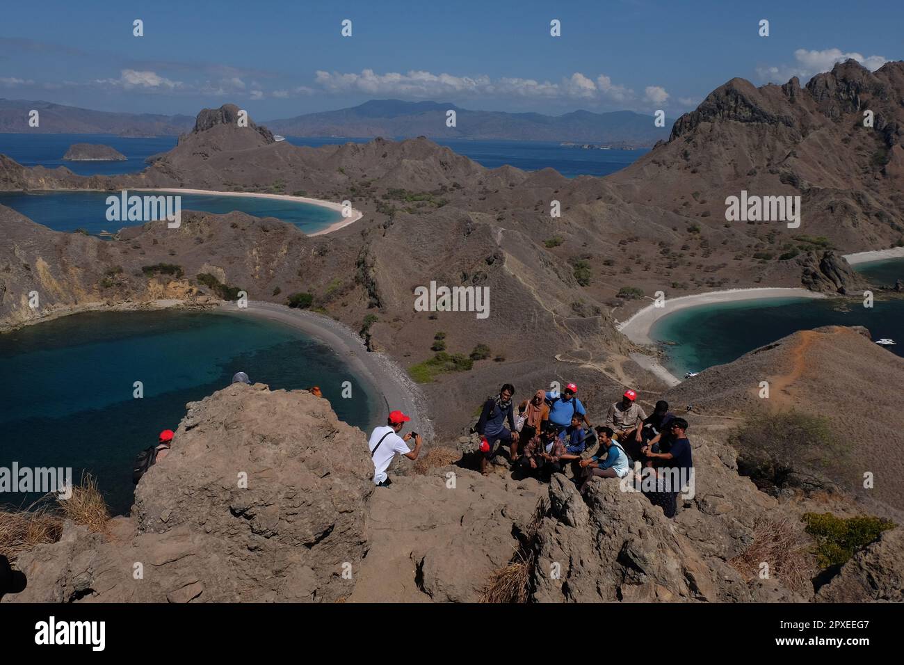 Tourists visiting Padar Island in Labuan Bajo during the dry season, a ...