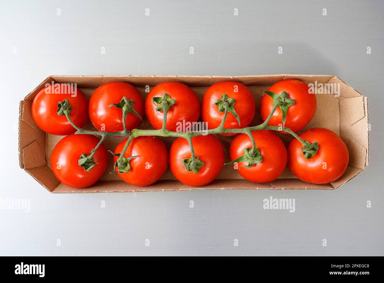 Cherry tomatoes in ecological cardboard box Stock Photo - Alamy