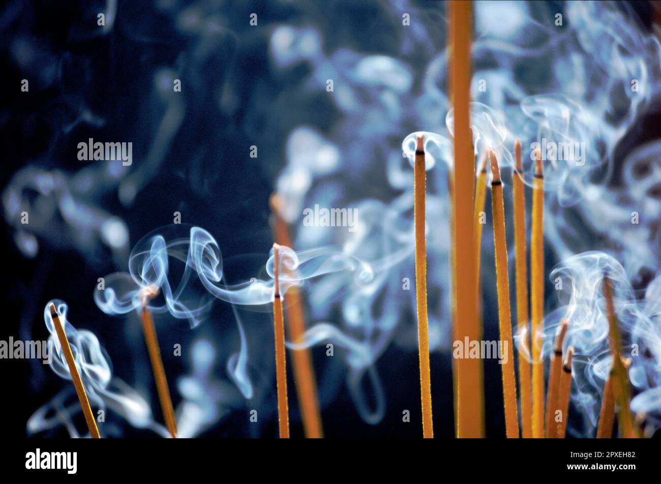 Scanned slide of historical color photograph showing smoke from incense ...