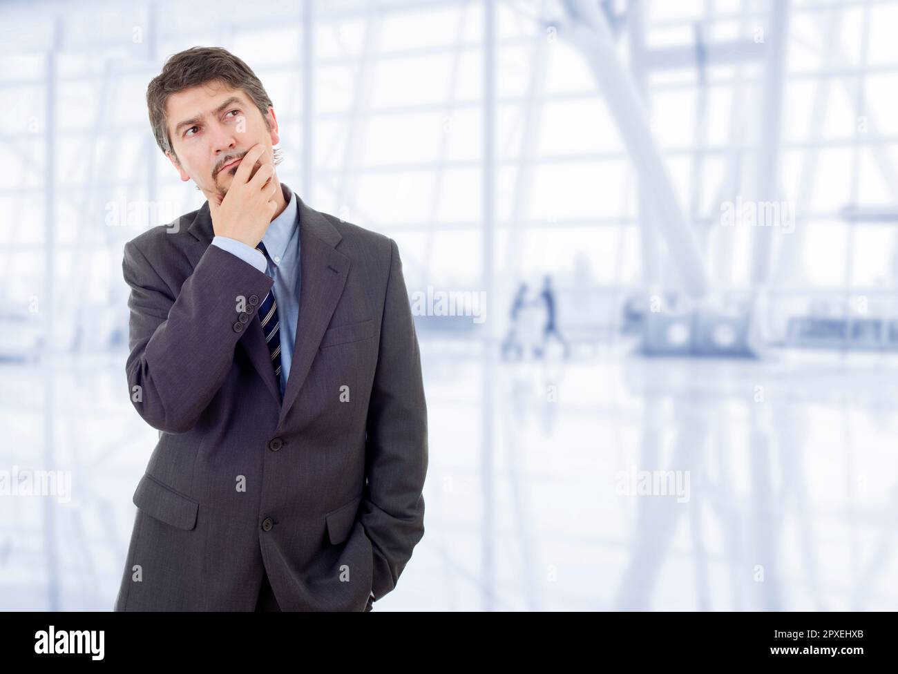 young business man thinking, at the office Stock Photo - Alamy