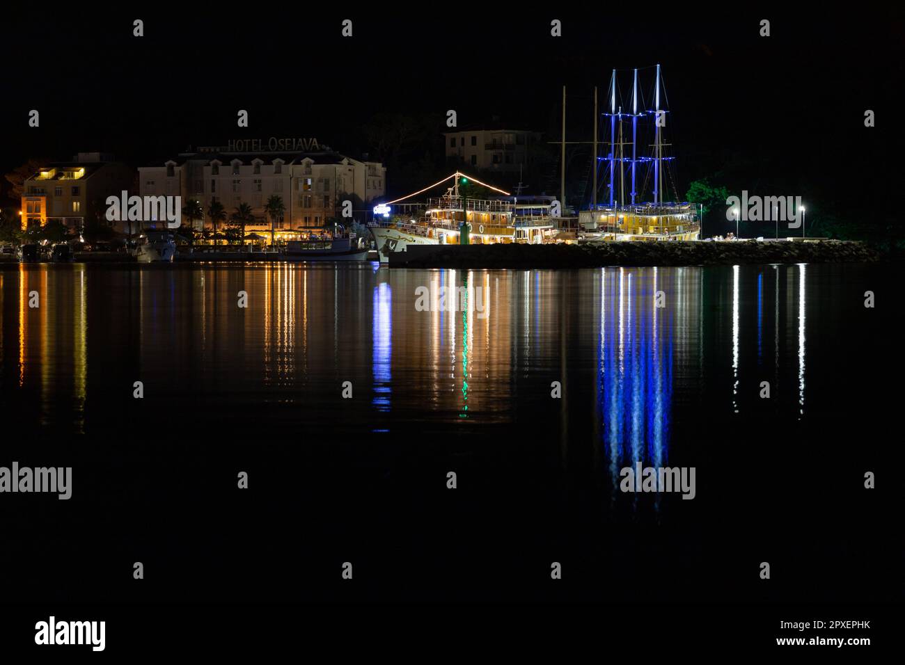 A stunning view of a port in Makarska, Croatia under the night sky ...