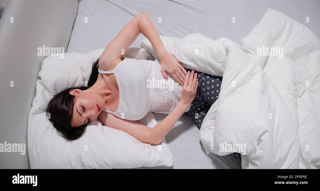 Women With Stomach Ache. Diarrhea Or PMS Pain Stock Photo - Alamy