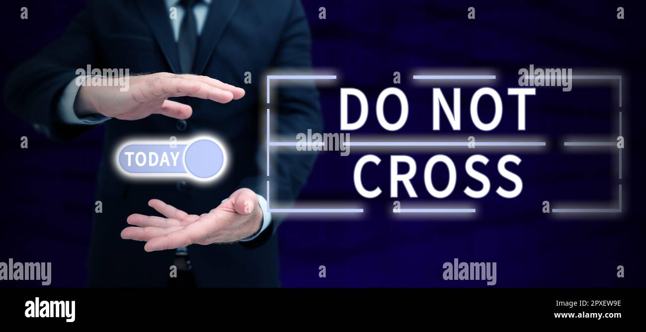 Sign displaying Do Not Cross, Concept meaning Crossing is forbidden ...