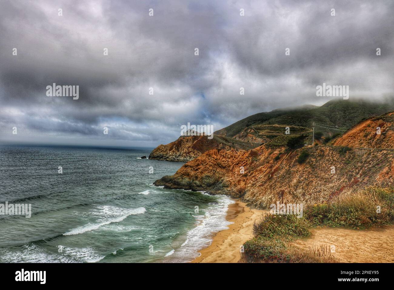 This breathtaking image features a picturesque beach with a stunning ...