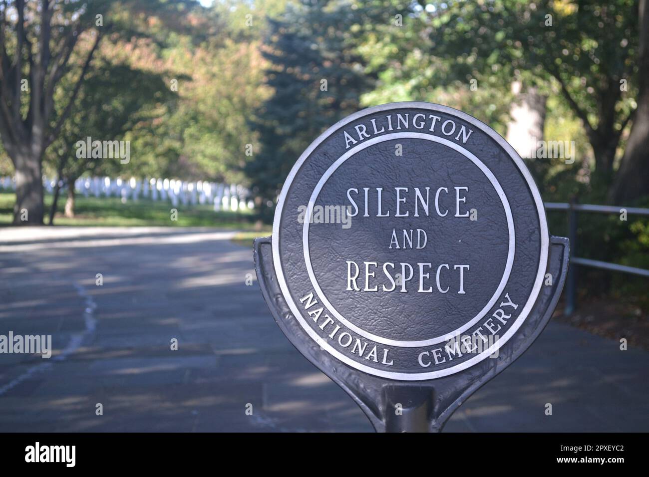 A black and white sign "Silence and Respect" hangs in front of a row of ...