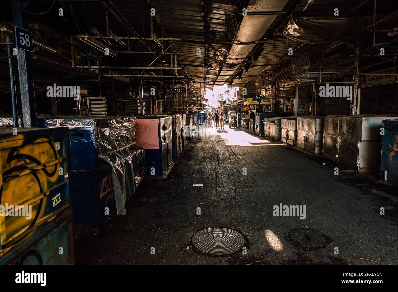 A desolate warehouse building with multicolor graffiti adorning the ...