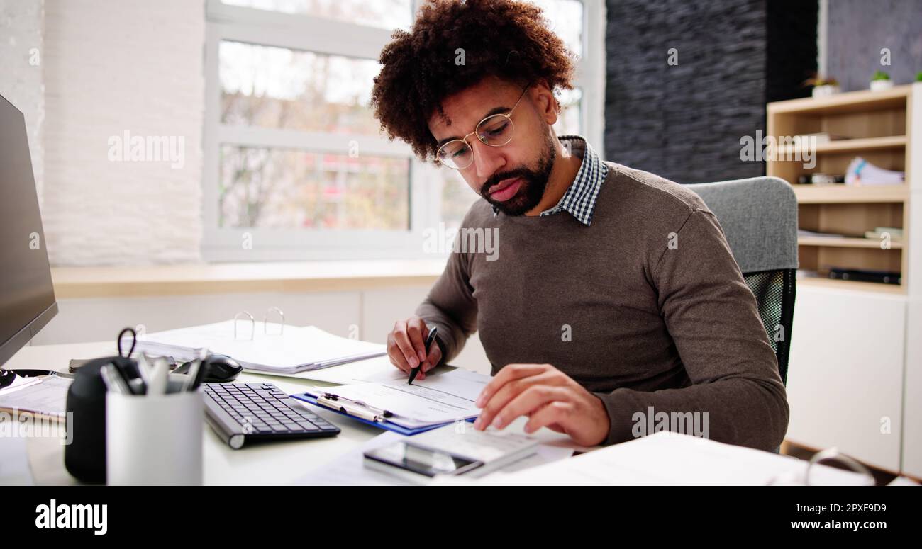 Portrait Of A Accountant Man Calculating Invoice Stock Photo - Alamy
