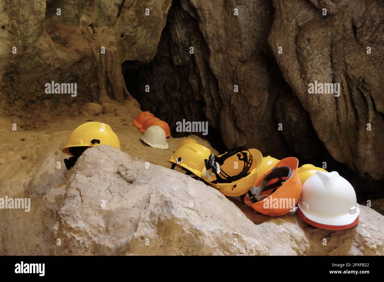 The helmet is on the rocks of the cave Stock Photo - Alamy